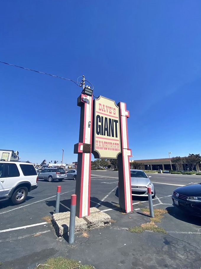 The sign stands tall, a landmark for burger pilgrims. Like the North Star for hungry travelers, it guides you to your delicious destination.