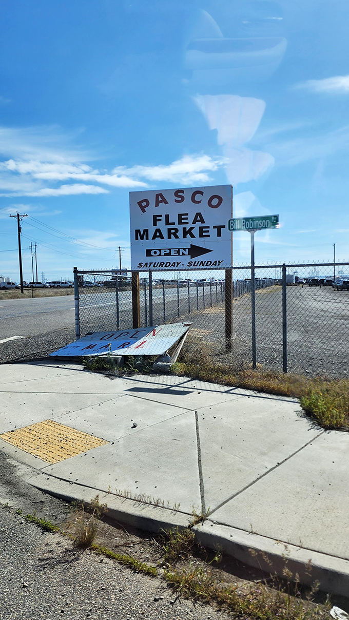 The gateway to adventure. This unassuming sign marks the entrance to a world where one person's "I don't need this anymore" becomes your "I've been looking everywhere for this!"