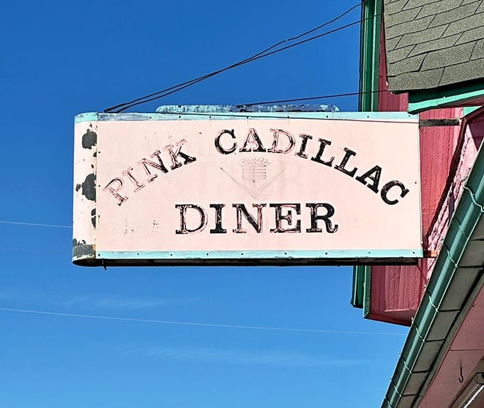The weathered sign has guided hungry travelers for years. Like a lighthouse for comfort food, it promises relief for empty stomachs and weary souls.