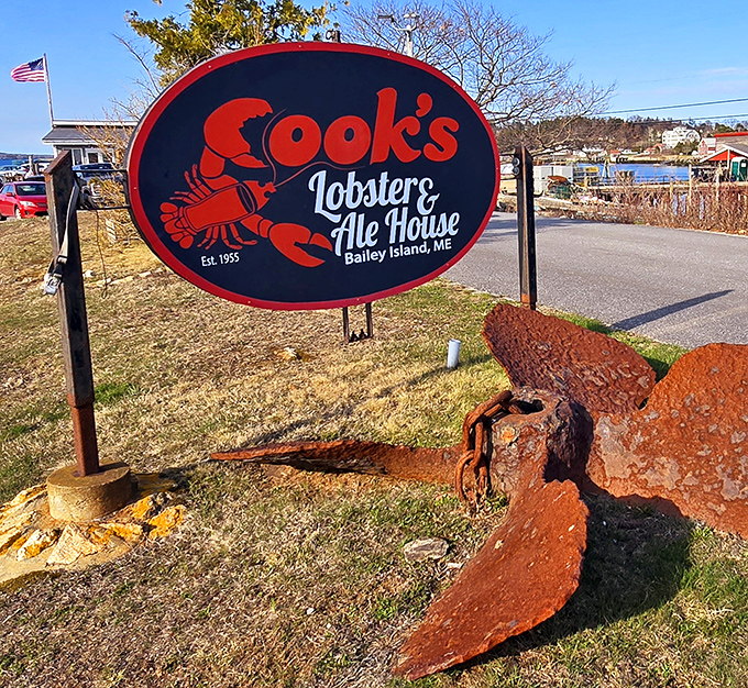 The weathered anchor beside Cook's iconic sign tells you everything: this place is anchored in tradition but never stuck in the past.