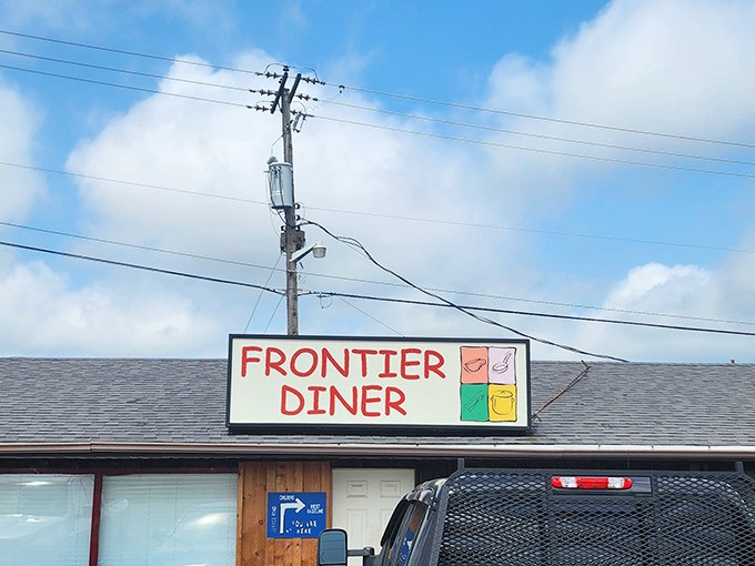 A sign that promises nothing it can't deliver. No fancy font or claims of artisanal anything&mdash;just good food waiting inside.