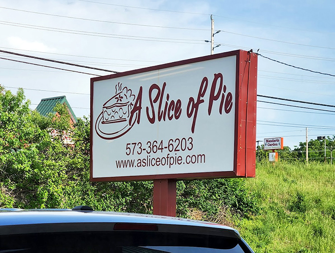 The roadside sign stands tall, a beacon of hope for travelers with empty stomachs and a craving for homemade goodness.