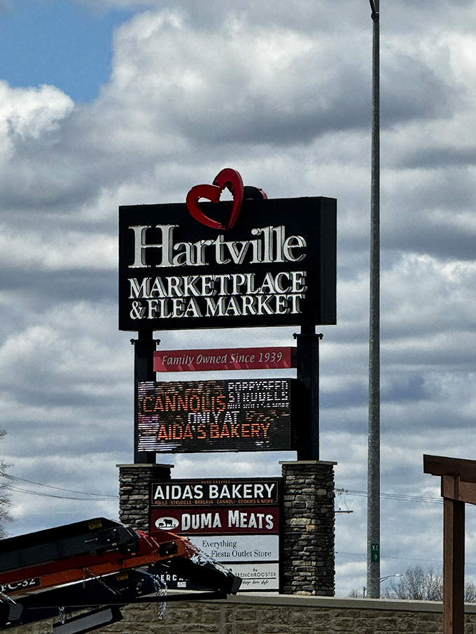 The iconic Hartville sign, promising family tradition since 1939 and teasing bakery treats that justify the entire trip.