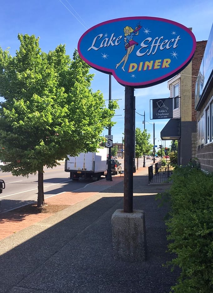 A sign that promises more than directions&mdash;it promises salvation for the hungry. That retro design isn't just nostalgic; it's a time portal to tastier days.