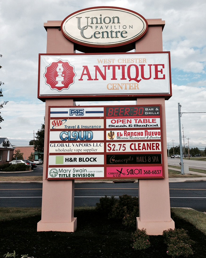 The shopping center sign announcing this hidden gem. Like finding a Tiffany lamp at a yard sale, it's all about knowing where to look.