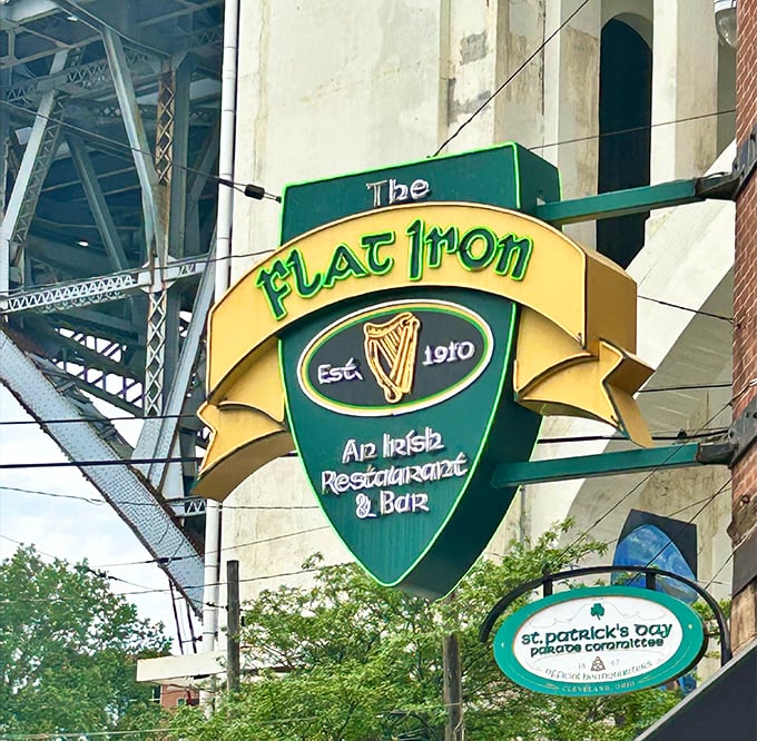 The iconic Flat Iron sign hangs like a beacon for hungry travelers, promising Irish hospitality in the heart of Cleveland's industrial landscape.
