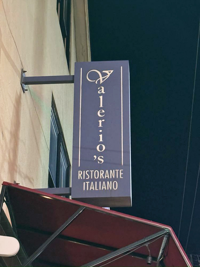 The vertical sign serves as a beacon for those seeking authentic Italian flavors in Cleveland's urban landscape.