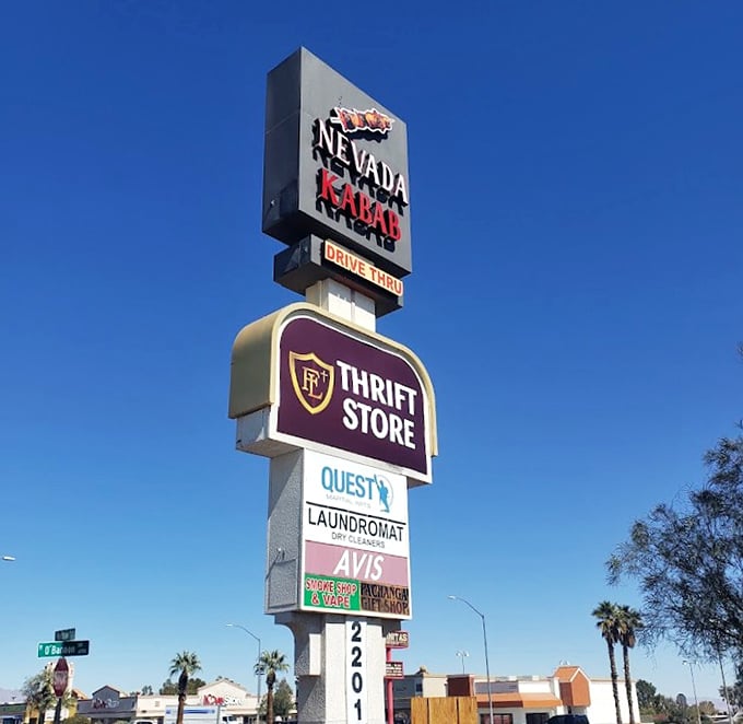 The roadside beacon that guides thrift enthusiasts to their destination—standing tall among Vegas signs that promise much more but deliver much less.