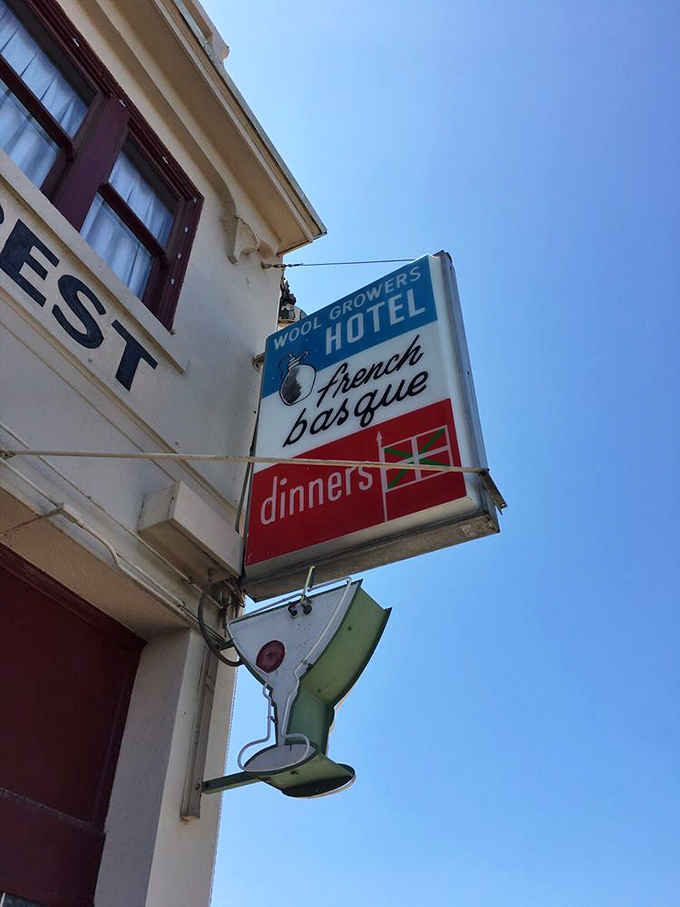 That vintage sign has been calling travelers off the highway longer than most of us have been alive.