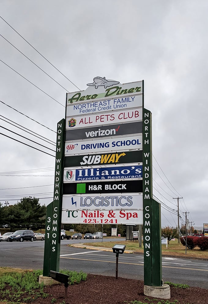 The roadside sign announces Aero Diner's presence among everyday businesses, like a culinary superhero hiding in plain sight on Route 6.