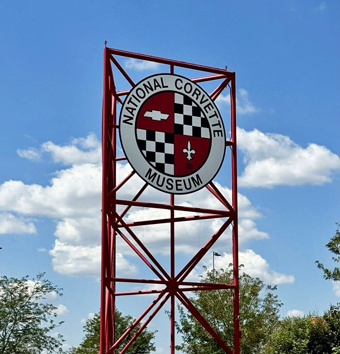 Standing tall against the Kentucky sky, the museum's signature logo sign serves as a rallying point for Corvette pilgrims making their journey to automotive mecca.