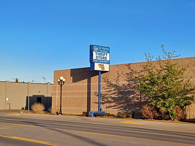 The roadside sign stands as a beacon for bargain hunters, announcing this temple of thrift to passing traffic on a beautiful Montana day.