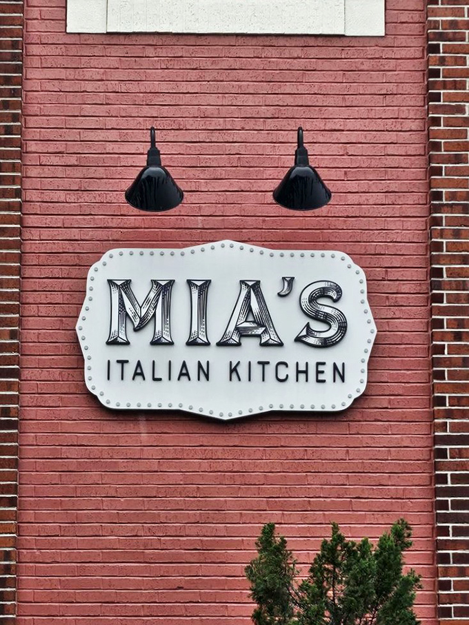That vintage-style sign on pink brick confirms you've found the place where giant meatballs become local legends worth driving for.