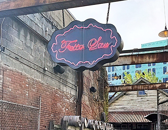 That vintage-style sign hanging overhead has guided countless hungry souls through the alleyway to their smoky salvation below.