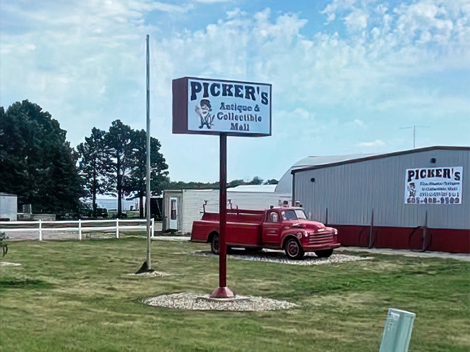 The vintage sign and truck announce: "Serious antiquing happens here." That classic Chevy pickup hasn't moved in years, but it's still working&mdash;as bait.