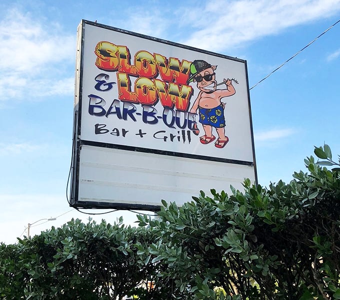 The sign says it all&mdash;a cartoon character living his best BBQ life. When your logo wears sunglasses, you know you're in Florida.