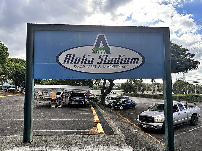The gateway to bargain bliss! This unassuming sign marks the entrance to a world where wallets open willingly and shopping bags multiply mysteriously.