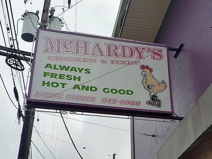 The sign promises "Always Fresh, Hot and Good"&mdash;three promises McHardy's keeps with religious devotion. The chicken cartoon knows what's up.