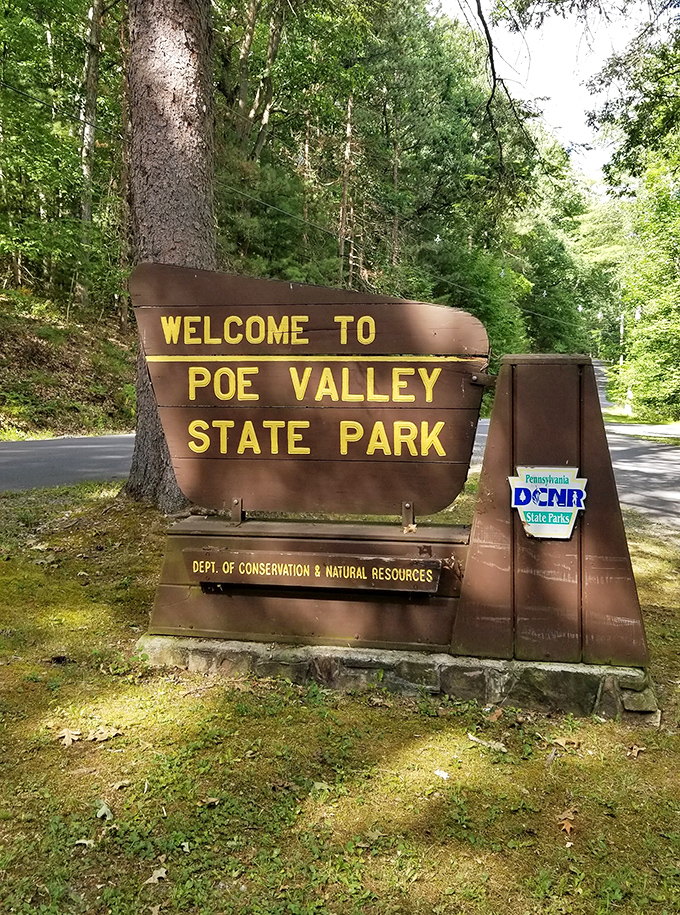 The entrance sign announces your arrival to paradise. Like finding the door to Narnia, but with better camping facilities and fewer talking lions.