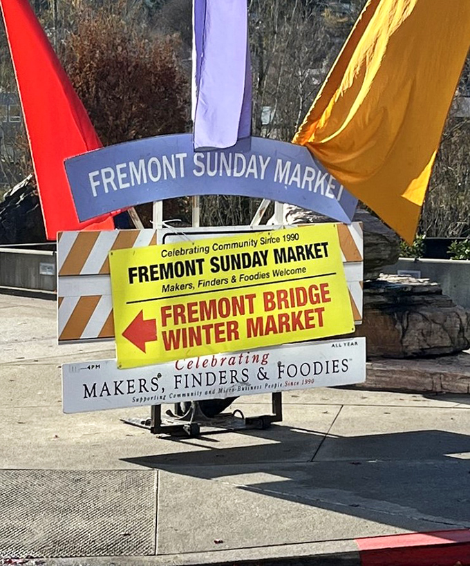 Makers, Finders & Foodies Welcome&mdash;the market's colorful sign promises a trifecta of Seattle pleasures every Sunday, rain or shine.