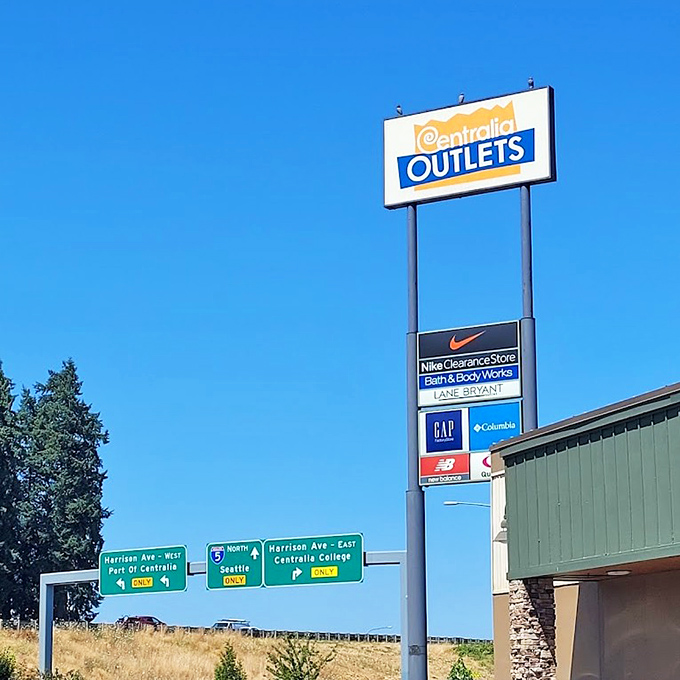 The beacon of bargains stands tall against Washington's blue sky, a roadside promise of retail adventures ahead.
