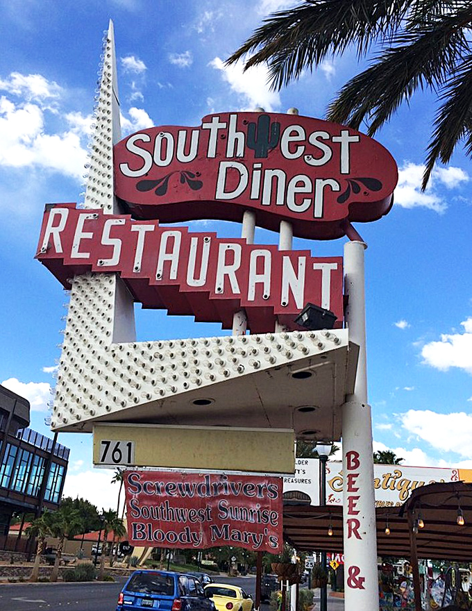 That sign isn't just announcing a restaurant—it's a neon-lit promise of comfort food that's been keeping Boulder City well-fed for generations.