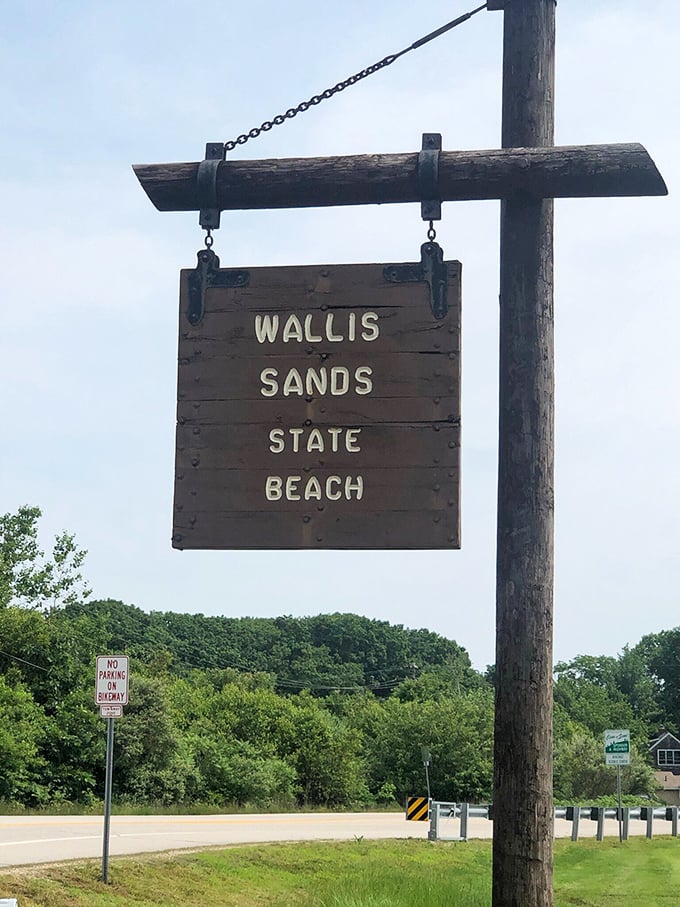 The wooden sentinel that welcomes beach-seekers to paradise. This weathered sign has directed generations of sun-worshippers to their Atlantic sanctuary.