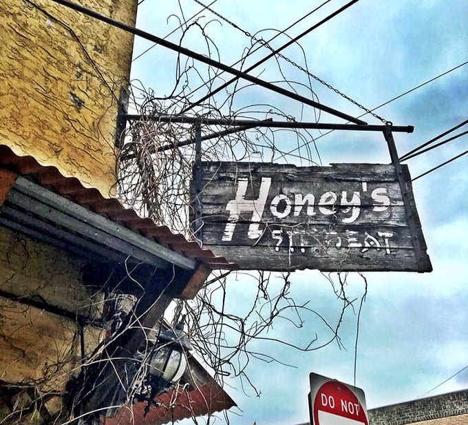 The weathered wooden sign swinging above the entrance promises simple pleasures&mdash;a place to sit and eat that delivers far beyond its humble name.