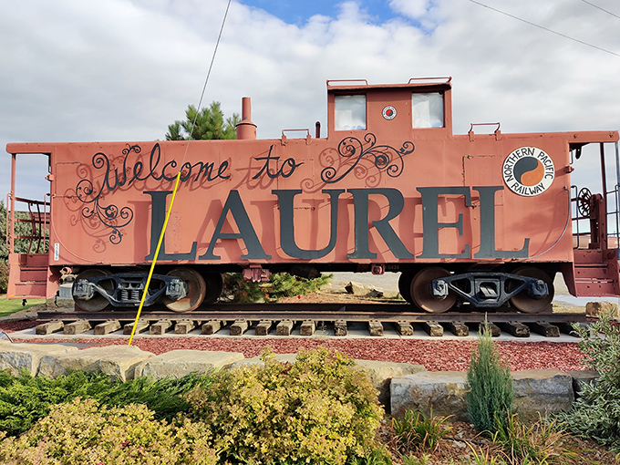 That vintage caboose welcomes visitors to Laurel with more personality than a thousand boring highway signs combined.