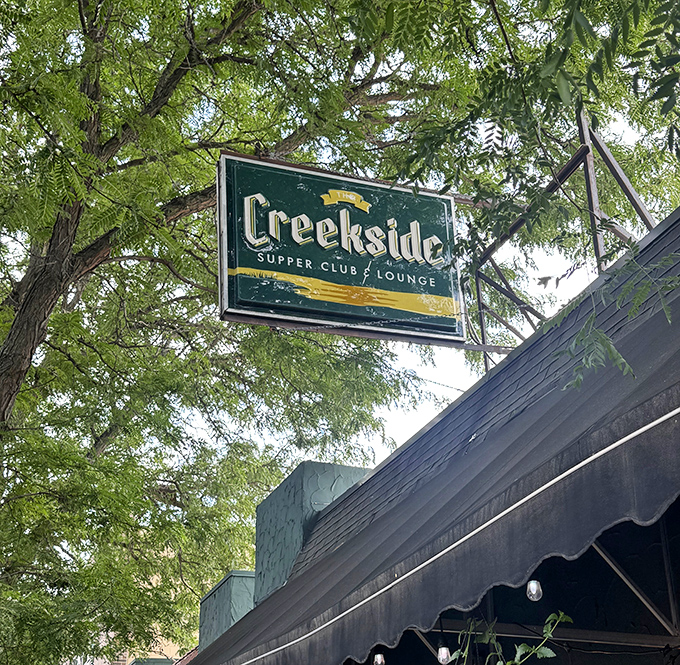 That sign isn't just announcing a restaurant&mdash;it's promising an experience. Beneath those green and gold colors lies a Minnesota institution. 