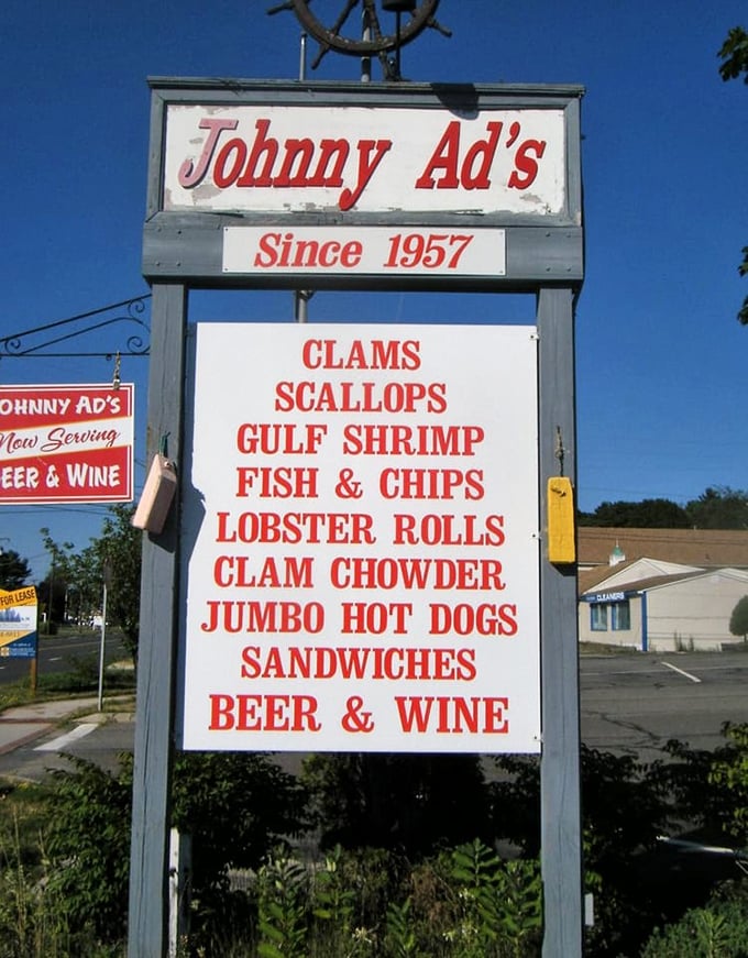 This sign isn't just advertising&mdash;it's a beacon of hope for hungry travelers, promising seafood salvation just ahead.