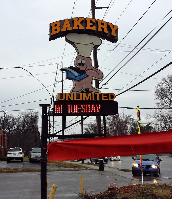 The whimsical sign featuring a chef with a cookbook promises old-school baking wisdom. Fat Tuesday never looked so tempting.