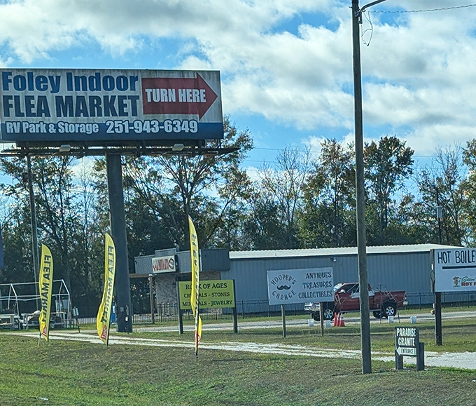 Follow the yellow flags to bargain paradise. This roadside sign is basically saying "Turn here for things you didn't know you needed."