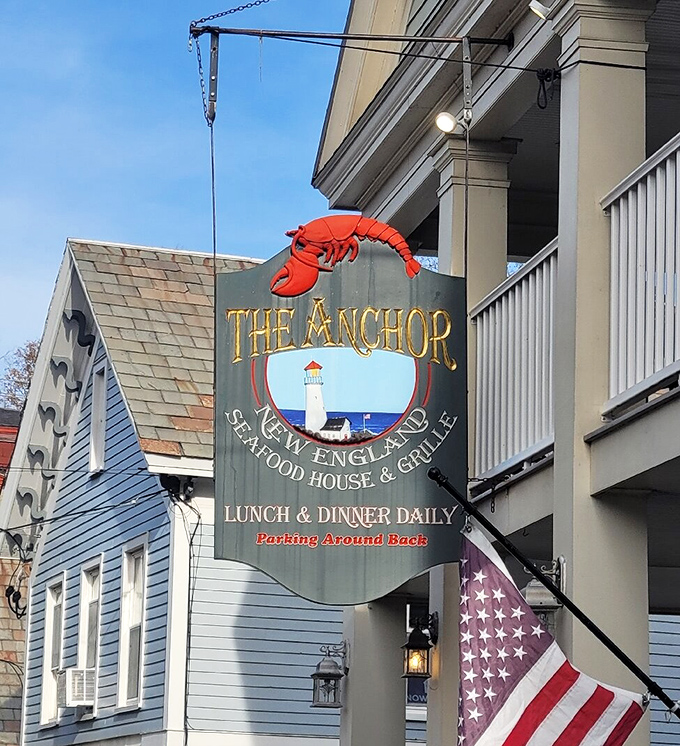 The iconic red lobster sign swings gently in the Vermont breeze, a delicious contradiction that promises oceanic delights in mountain country.
