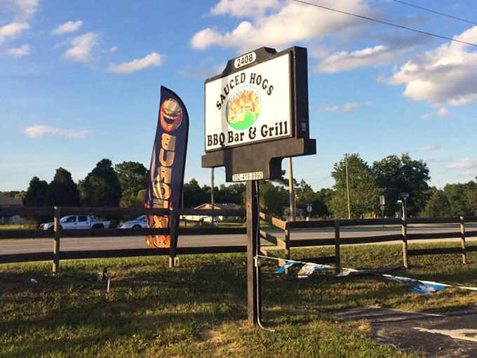 The roadside sign stands as a humble invitation – nothing fancy here, just some of the best barbecue you'll find off Florida's beaten path.