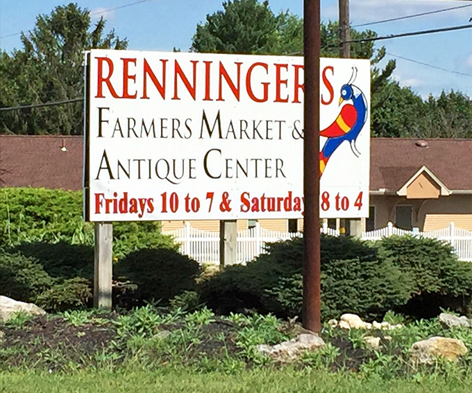 The beacon that guides treasure hunters to paradise. Renninger's sign stands as a colorful promise of weekend adventures waiting just beyond.