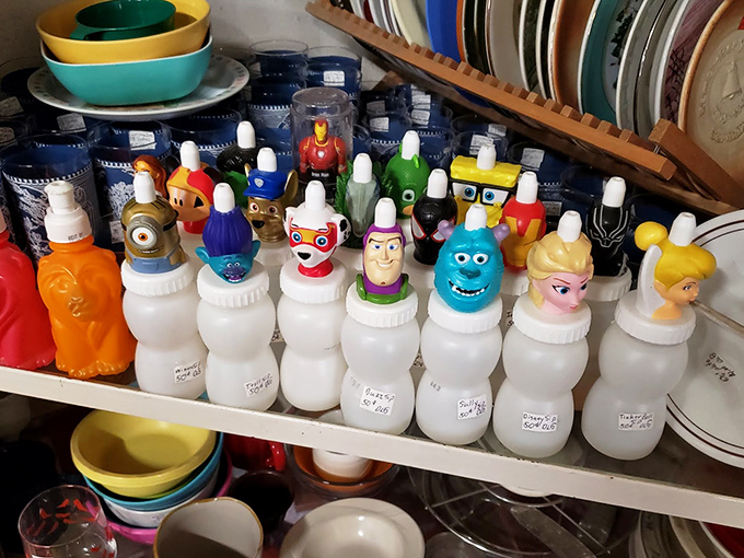 Character-topped squeeze bottles stand at attention like a plastic pop culture army&mdash;from Minions to Disney princesses, childhood memories in portable form.