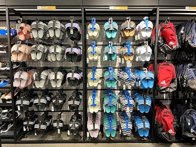 The Adidas display presents a rainbow of slides and backpacks&mdash;because nothing says "successful shopping trip" like matching footwear and accessories.