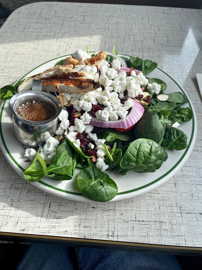 A salad that doesn't feel like punishment. Fresh spinach, tangy goat cheese, and grilled chicken prove healthy eating doesn't require a sacrifice to the flavor gods. 