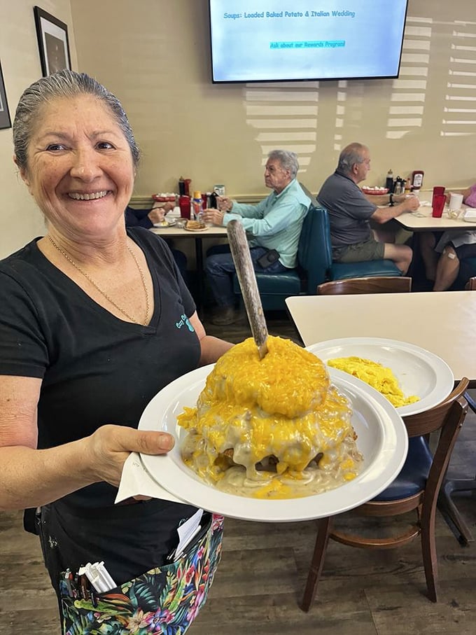The universal language of breakfast joy&mdash;a mountain of food that says "You won't need lunch" delivered with a smile that makes calories irrelevant.