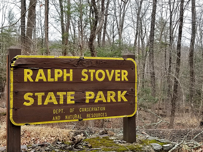 The sign that promises escape from spreadsheets and Zoom calls. Yellow letters on brown wood never looked so inviting.