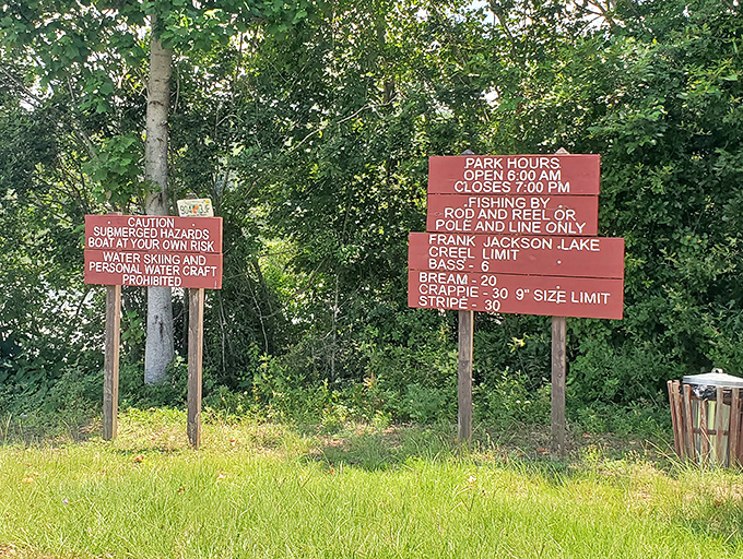 Park regulations reminding visitors of fishing limits and hours, because even paradise needs a few reasonable rules.