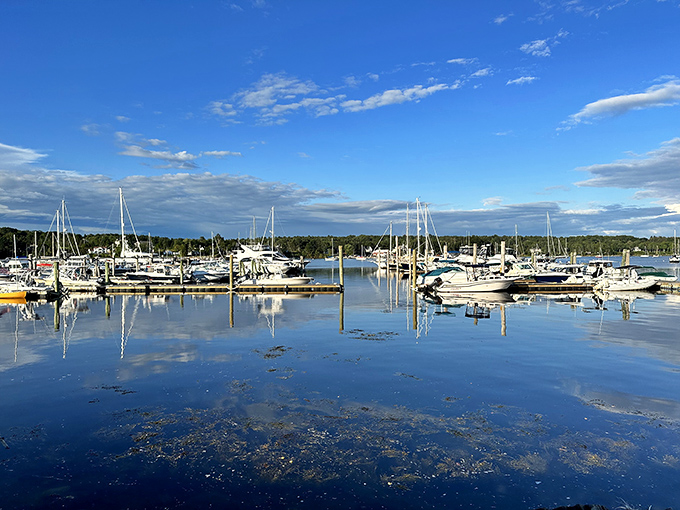Steamboat Landing Park mirrors boats in glassy water, where morning coffee tastes better with this view.