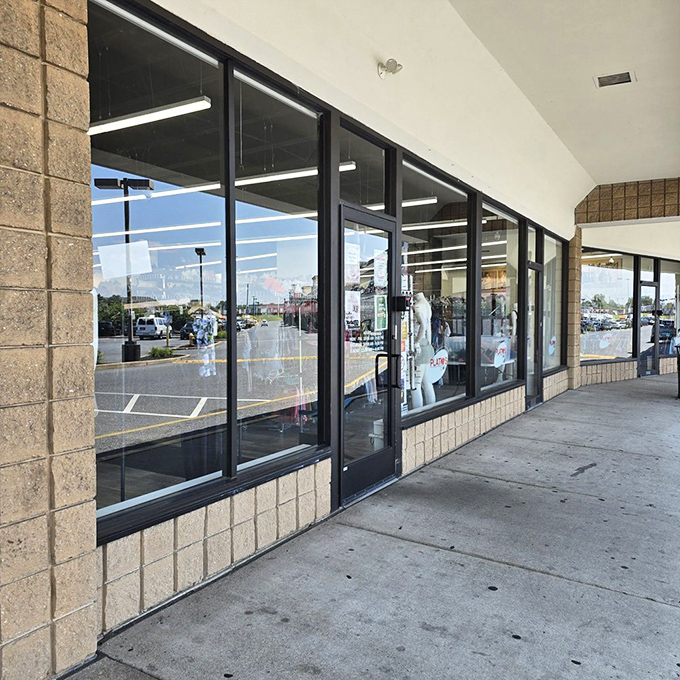 The entrance to Plato's Closet: where fashion philosophy meets practical economics in a retail marriage that actually works.