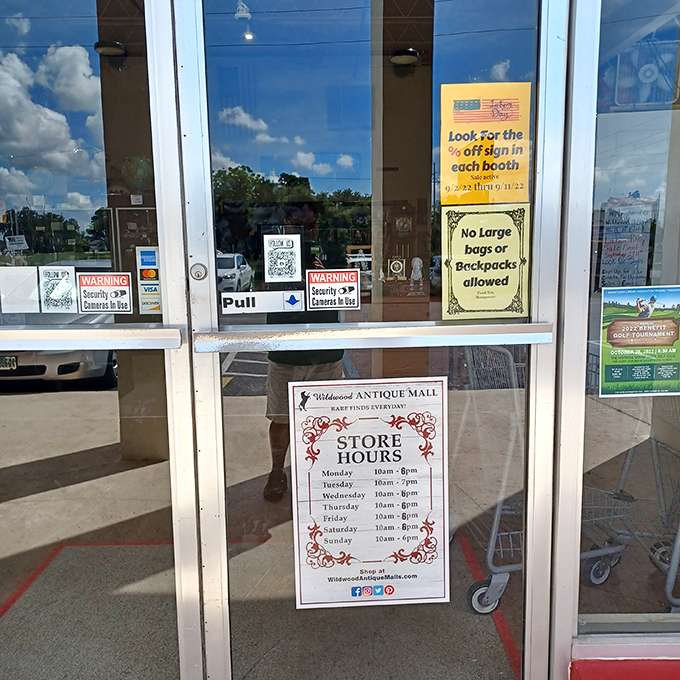 The store hours sign&mdash;your roadmap to treasure hunting success. Note Tuesday's extended hours, perfect for after-work antiquing expeditions.