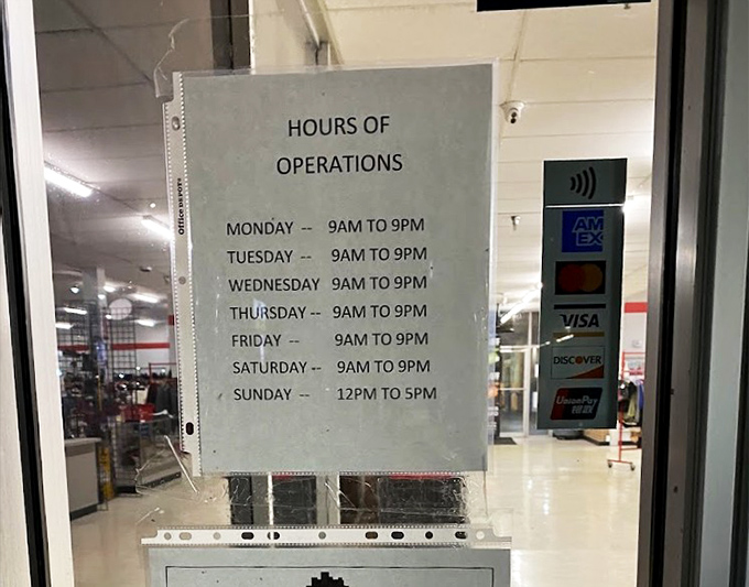 The hours of operation sign&mdash;the only predictable element in a store where every other detail changes daily in the best possible way.