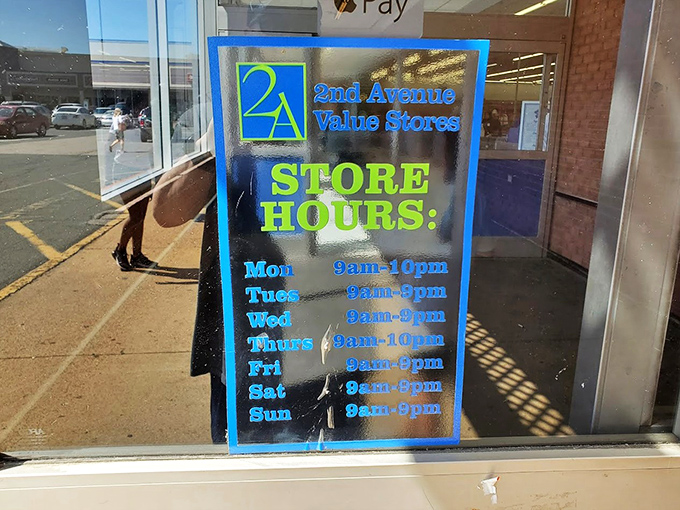 The store hours sign&mdash;your roadmap to planning the perfect thrifting expedition, with extended Thursday hours for those serious about their secondhand quests.