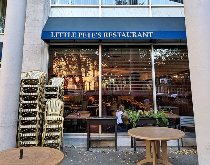 That blue awning might as well say "Happiness Served Here" &ndash; truth in advertising at its finest.