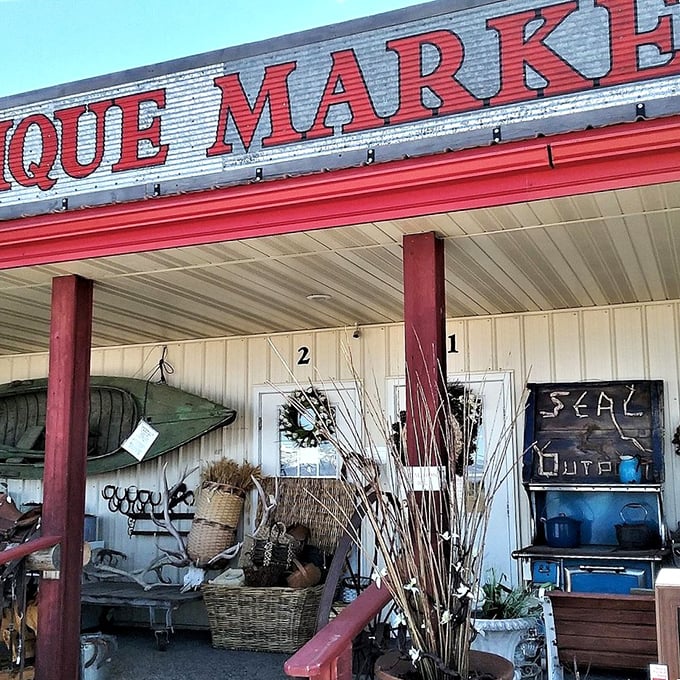 The distinctive red trim and "ANTIQUE MARKET" signage serves as a beacon for collectors. Those wicker baskets are practically calling your name!