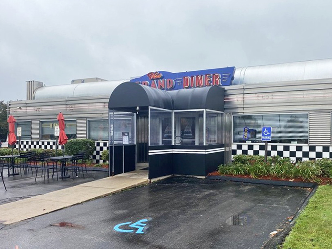 Even on rainy days, The Grand Diner's exterior beckons with its retro charm and promise of comfort food salvation.